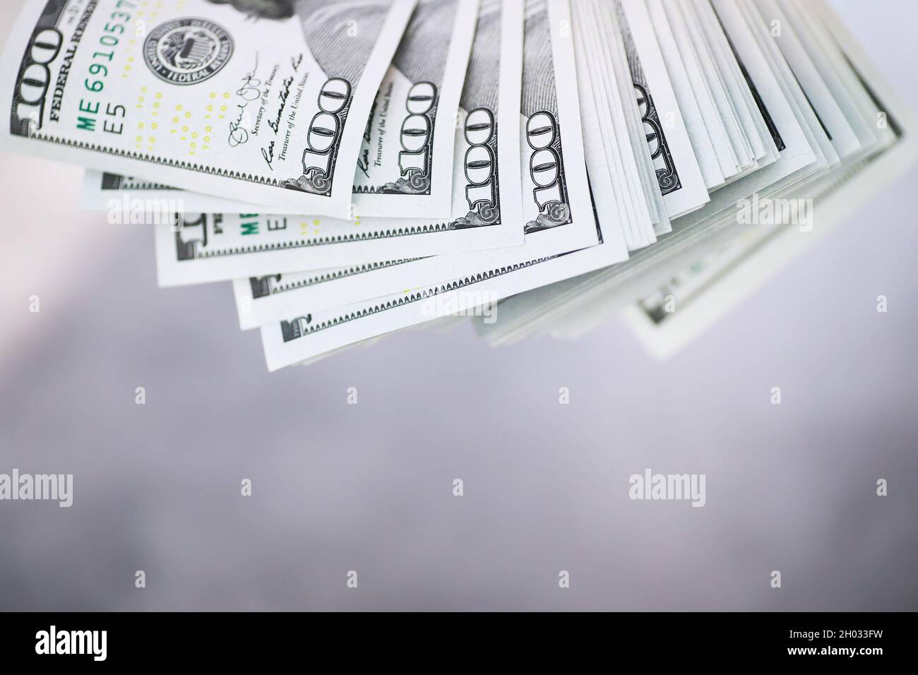 Cash money in a large pile as a finance background. Paper money close ...