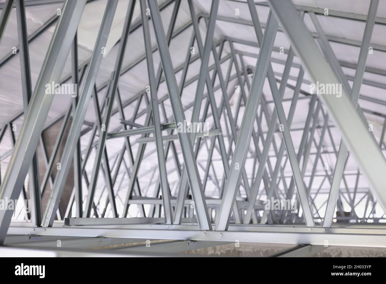 Structure of steel roof frame for building construction closeup Stock ...