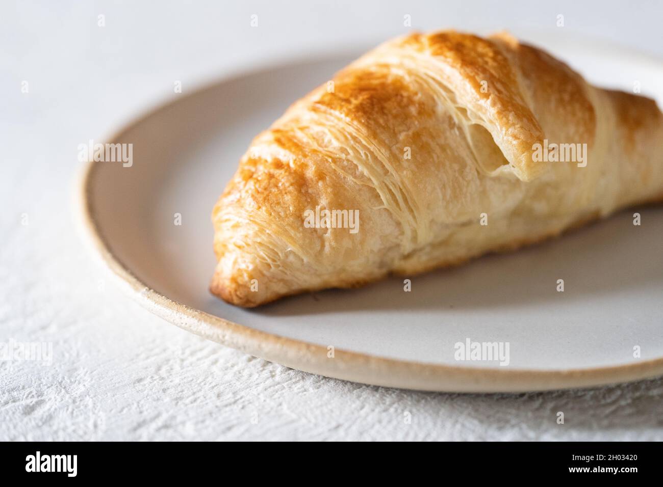 Fresh croissant for family breakfast Stock Photo - Alamy