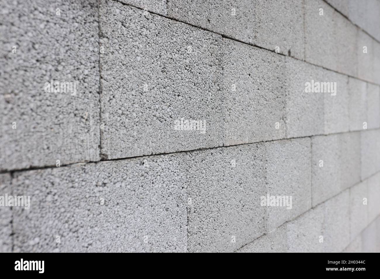 Gray concrete wall made of rectangular blocks Stock Photo - Alamy