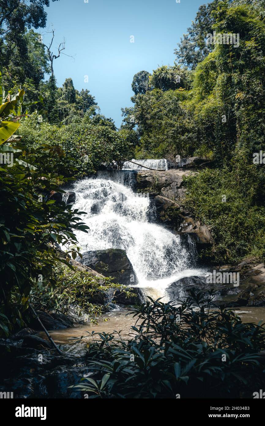 Travel Waterfall in a tropical forest in the daytime Stock Photo - Alamy