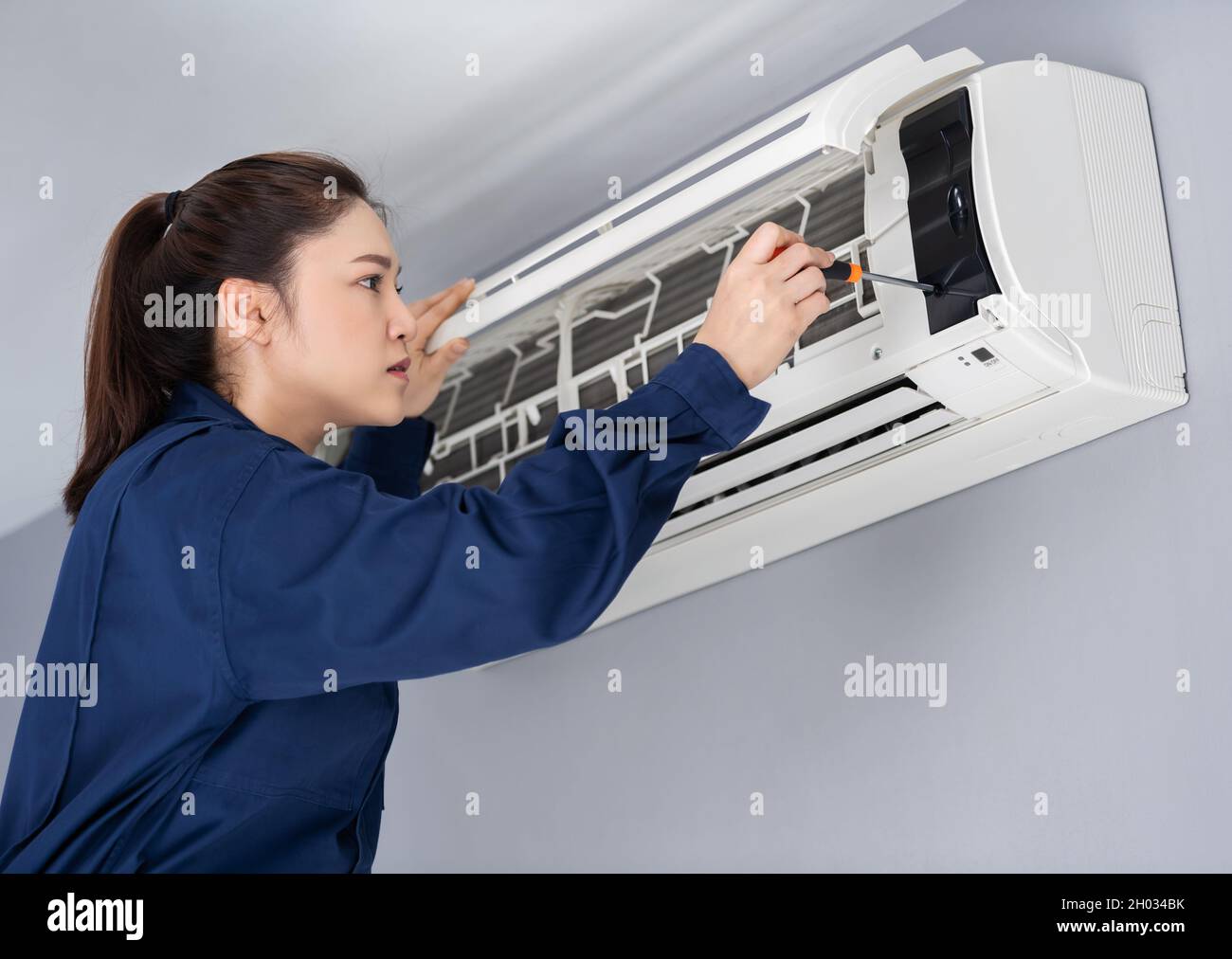 Person using air conditioner hi-res stock photography and images - Alamy