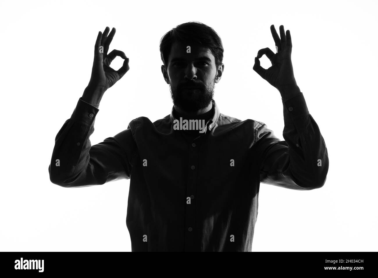 Man with a pistol in hand crime hand gesture light background Stock ...