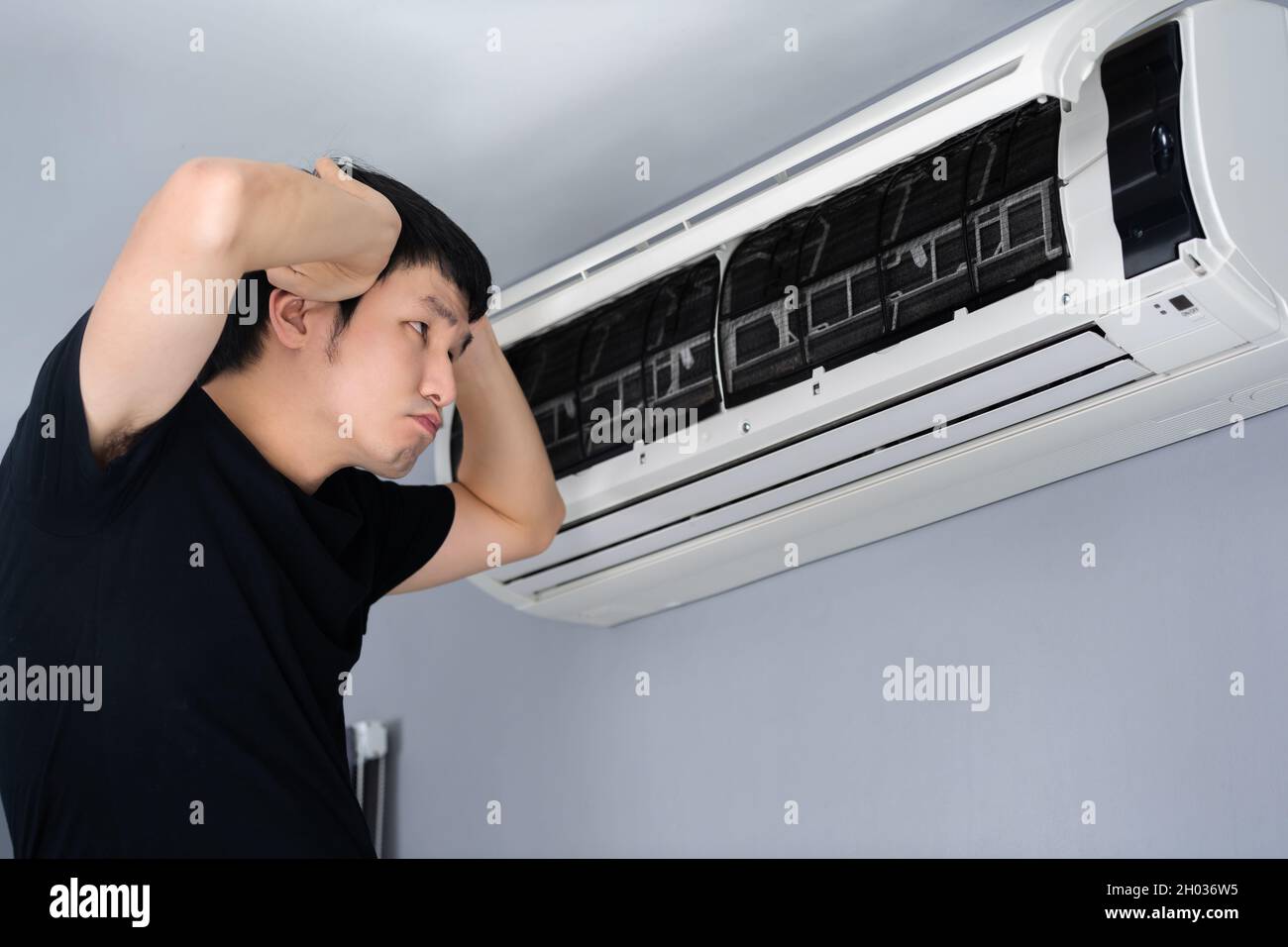 Sad young man cleaning hi-res stock photography and images - Alamy