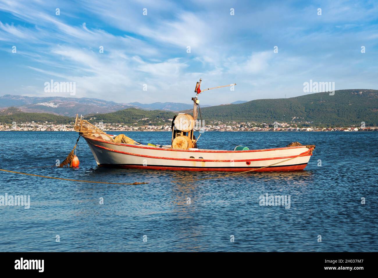 Old traditional fishing boat or trawler anchored on the sea Stock Photo ...