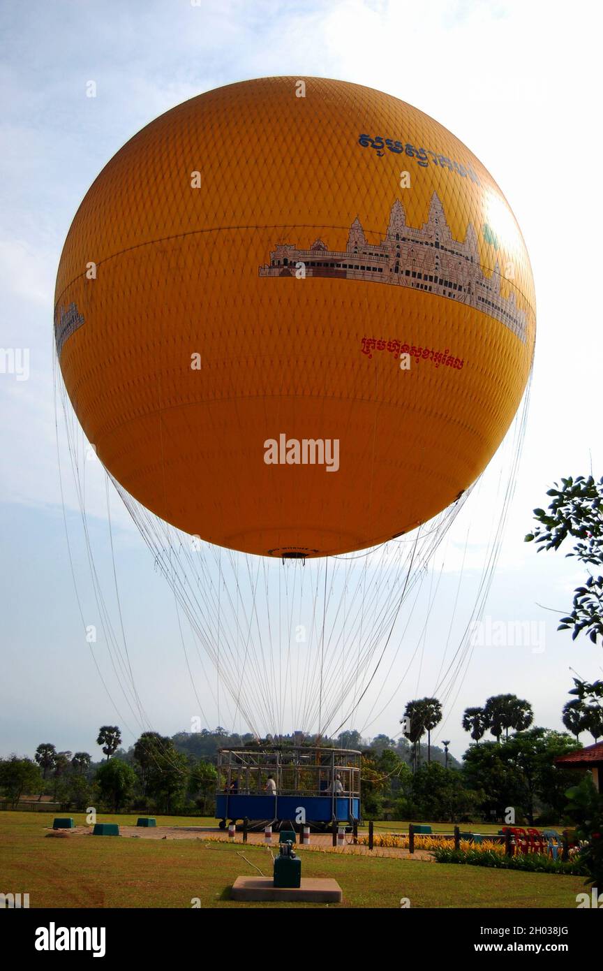 Yellow balloon flying bring cambodian people and foreign travelers ...