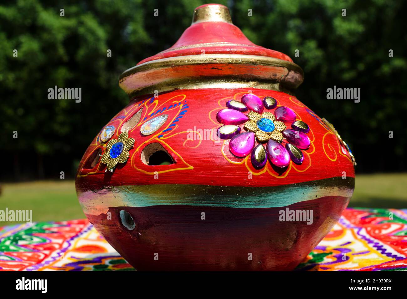 Traditional navratri festival earthen clay pot known as Garba or Garbo ...
