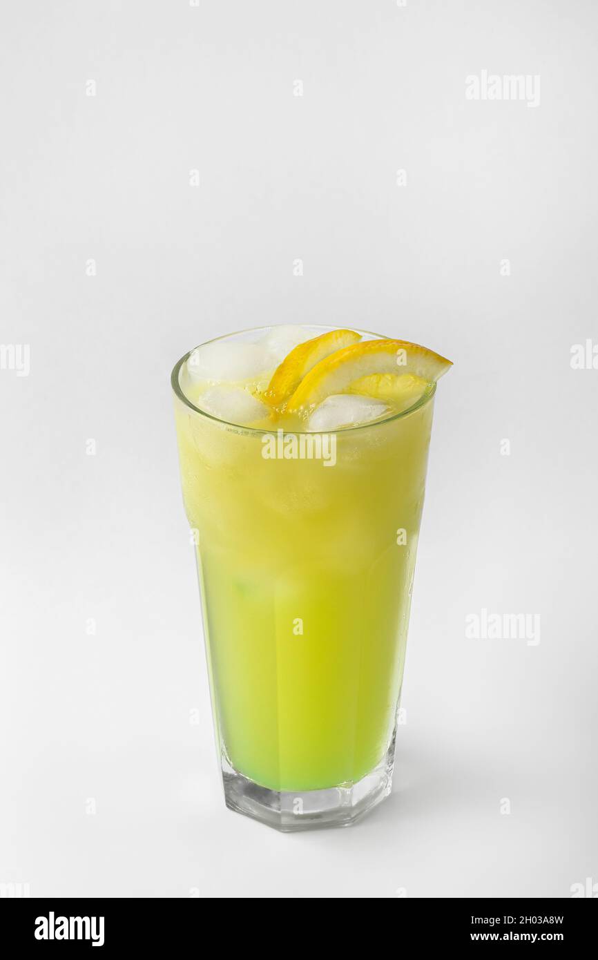 beautiful transparent glass of summer drink. green and yellow lemonade ...