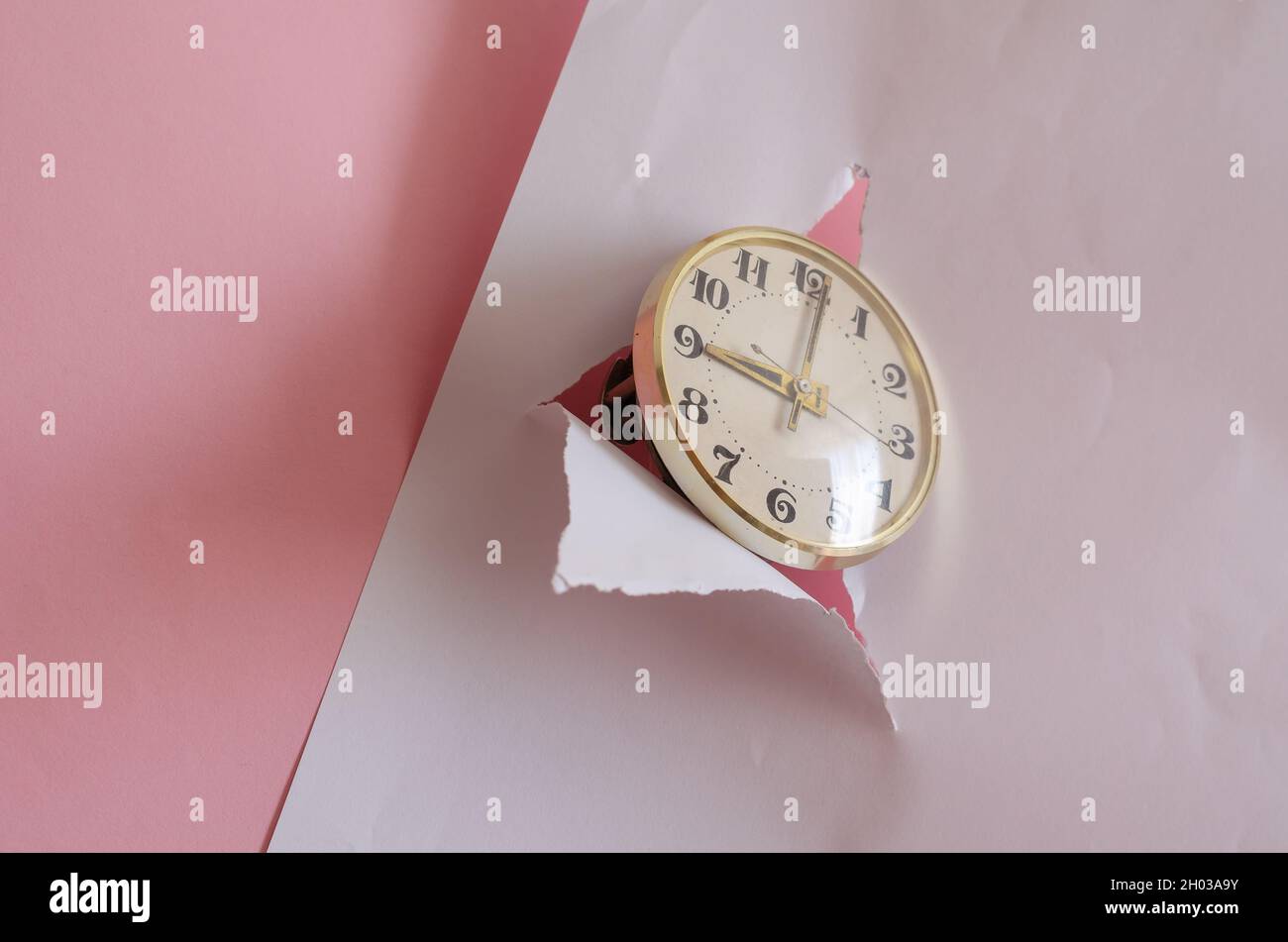 Vintage clock, white tear paper, pink background. Round Mechanical ...