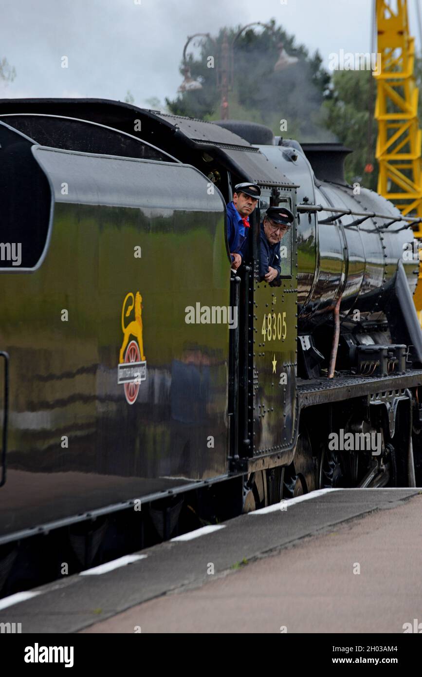 Train Driver & fireman of ex LMS "8F" steam locomotive 48305 wait to ...