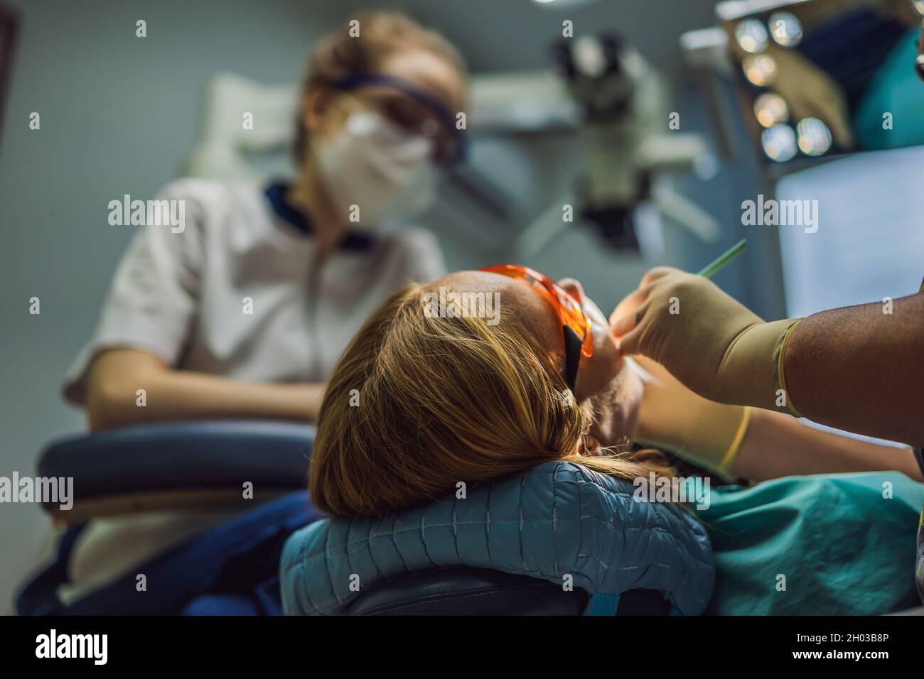 Woman having teeth examined at dentists. Dental treatment in dentistry ...