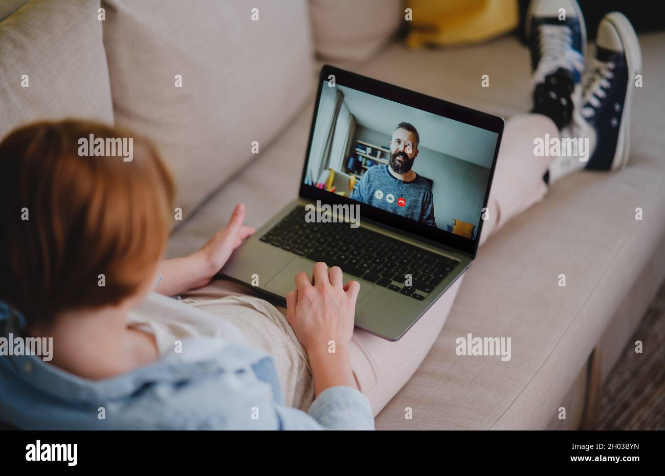 Young woman at home making video call using tablet, social networks ...