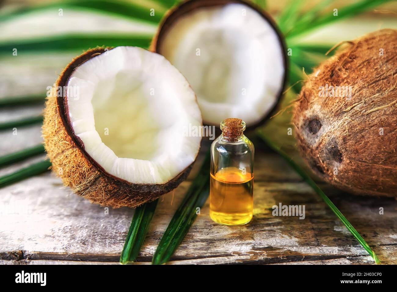 Natural coconut oil in a bottle. Selective focus Nature Stock Photo - Alamy