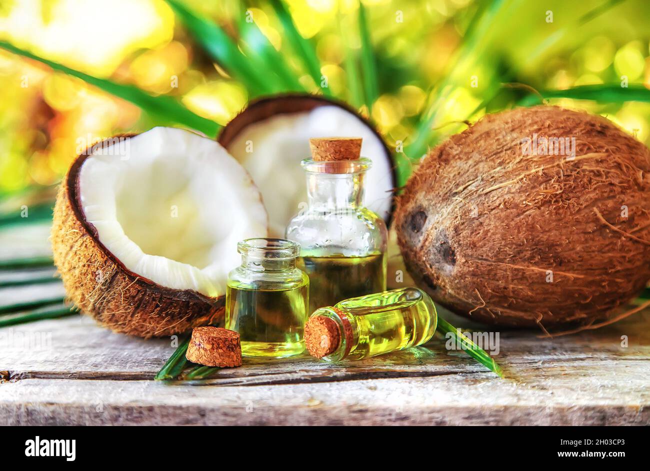 Natural coconut oil in a bottle. Selective focus Nature Stock Photo - Alamy
