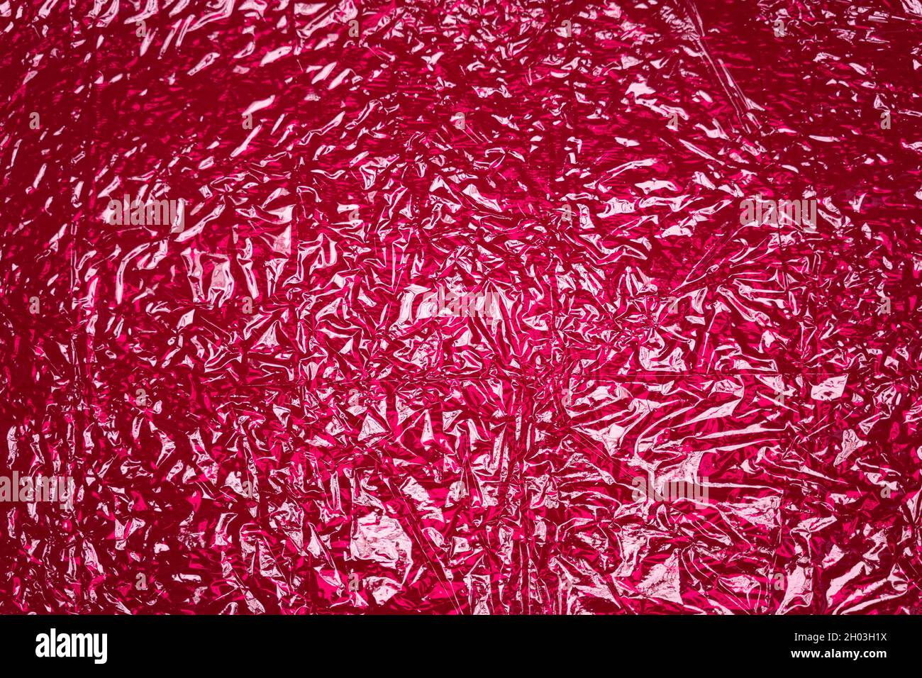 hot pink shiny reflective textured plastic background Stock Photo - Alamy