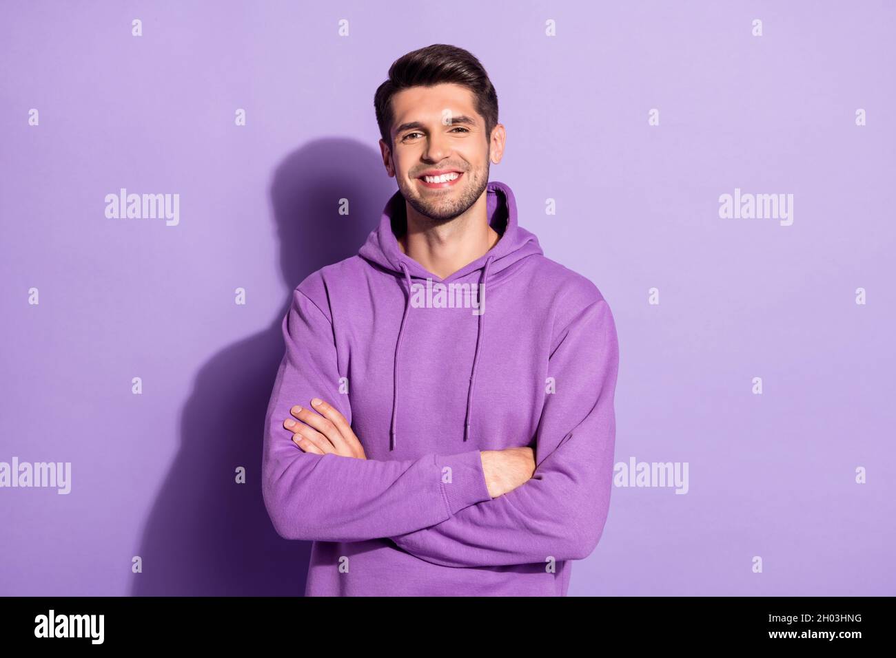 Portrait of attractive content cheerful guy folded arms wearing cosy ...