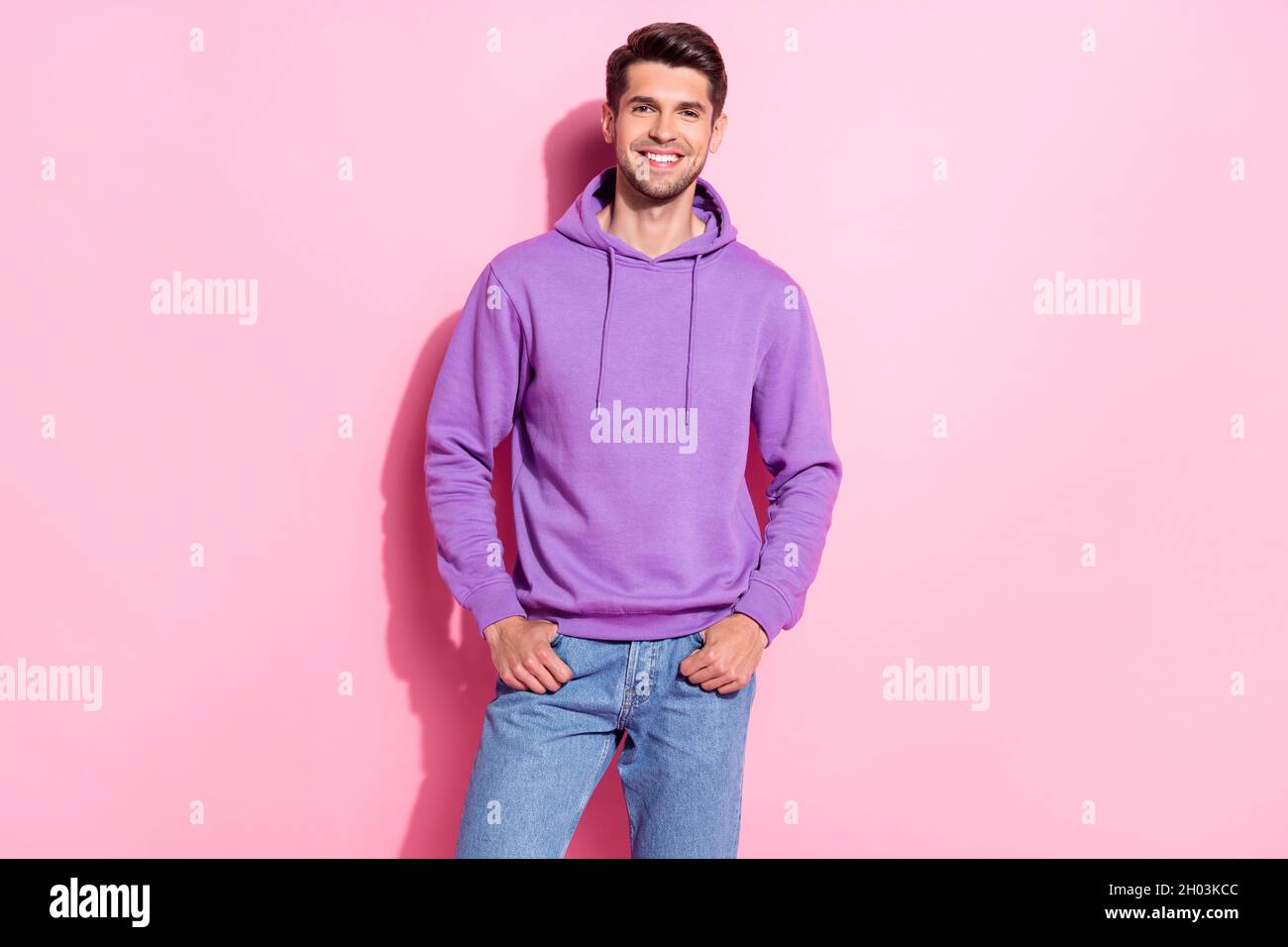 Portrait of attractive cheerful content guy wearing cozy hoody posing ...