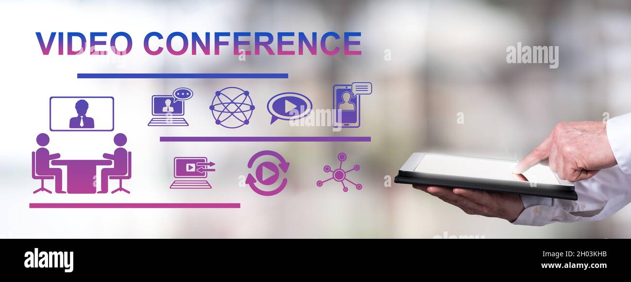 Man using a tablet with video conference concept Stock Photo - Alamy