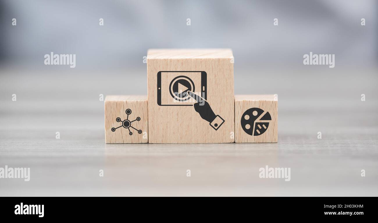 Wooden blocks with symbol of video marketing concept Stock Photo - Alamy