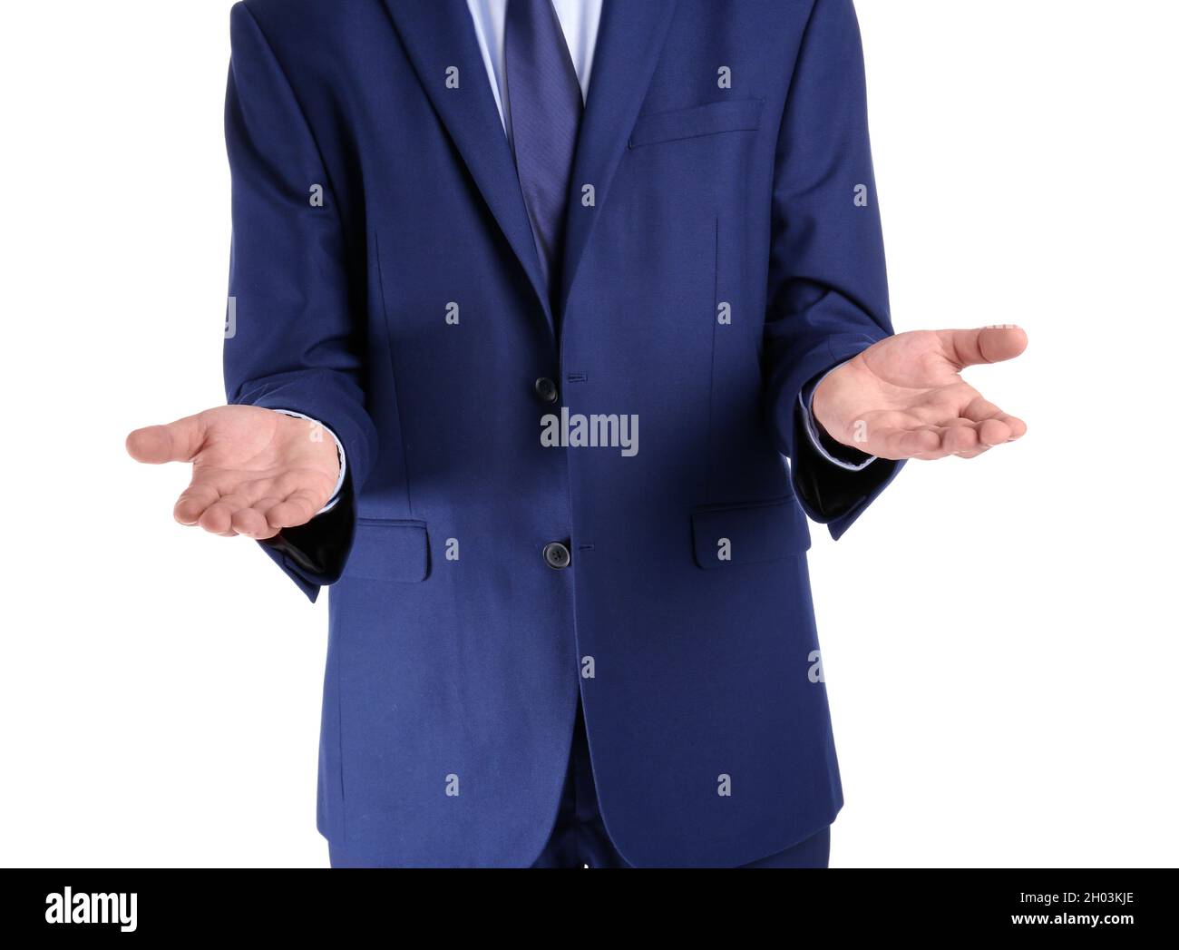 Businessman showing balance gesture on white background Stock Photo - Alamy