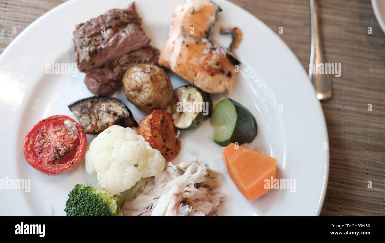 Cooked Food Buffet on a Plate Cauliflower Cucumber Zucchini Tomato ...