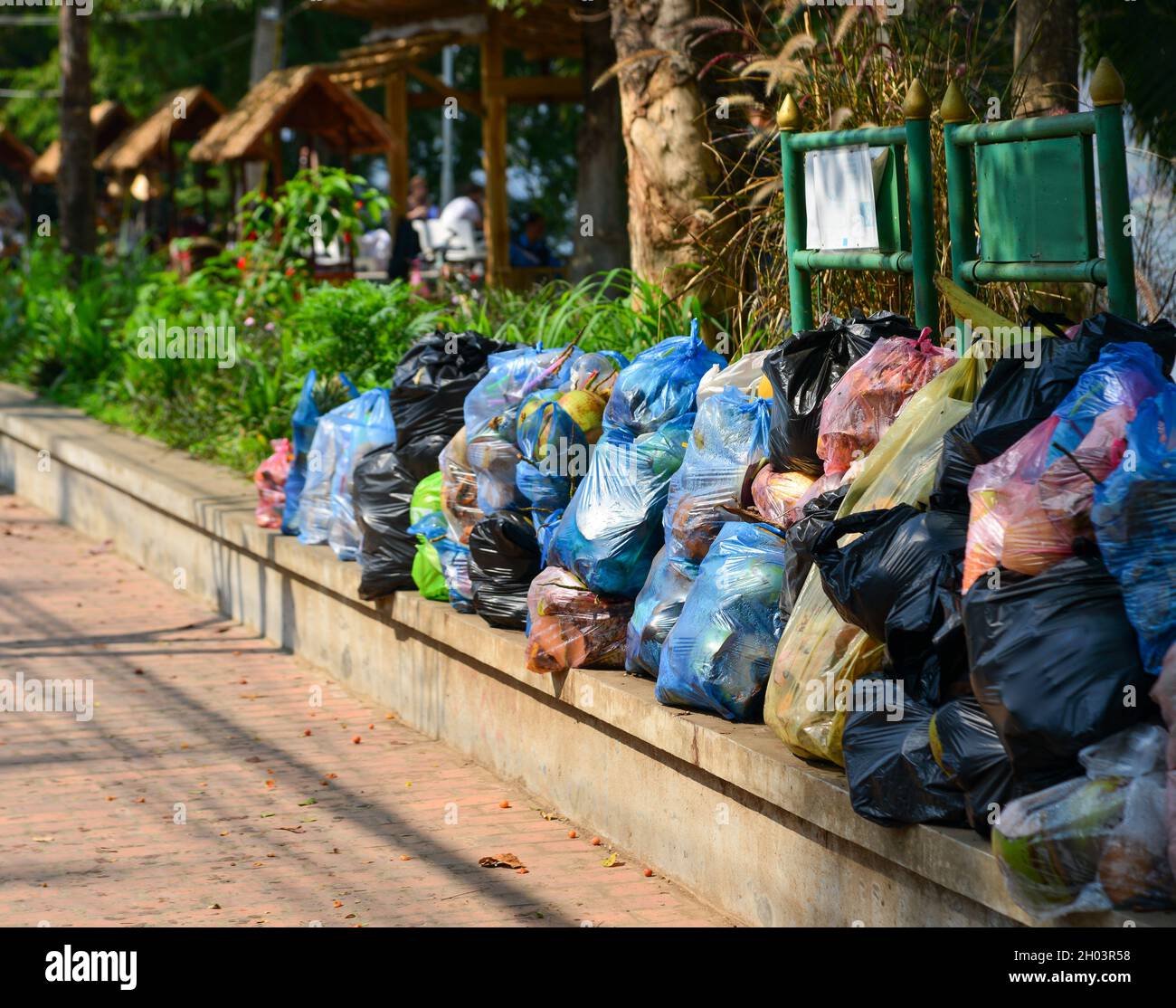Garbage bags on the road in Luang Phrabang, Laos. Waste and ...