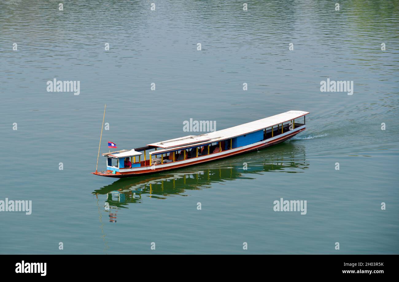 Luang Phrabang, Laos - Feb 4, 2020. Tourist boat on Mekong River in ...