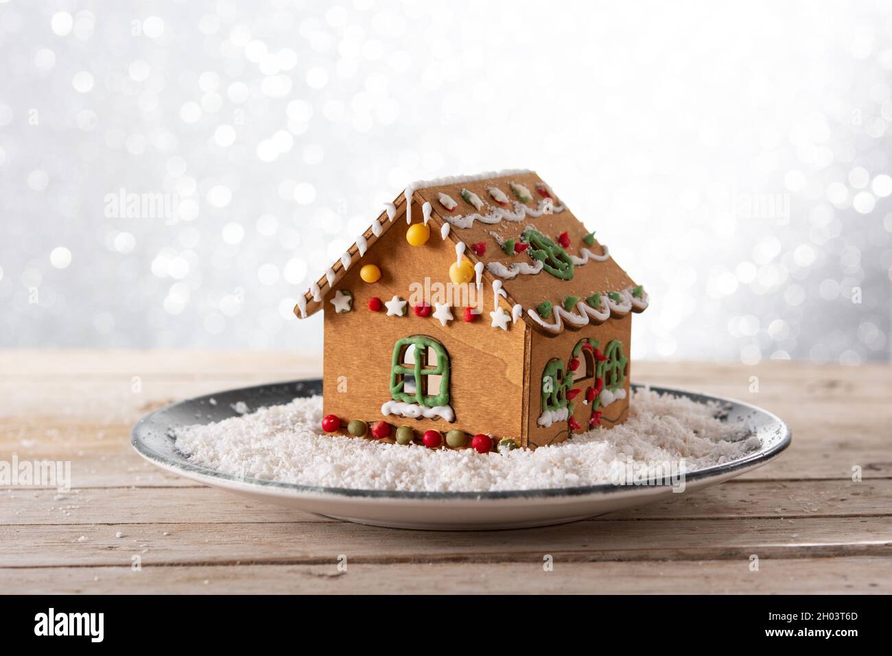 Christmas gingerbread house on glitter background Stock Photo - Alamy