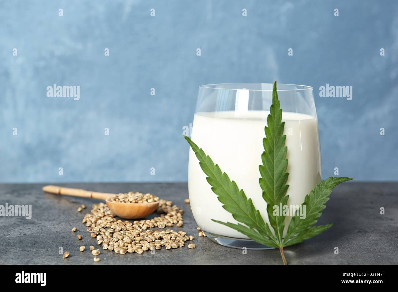 Composition with hemp milk on grey table Stock Photo - Alamy
