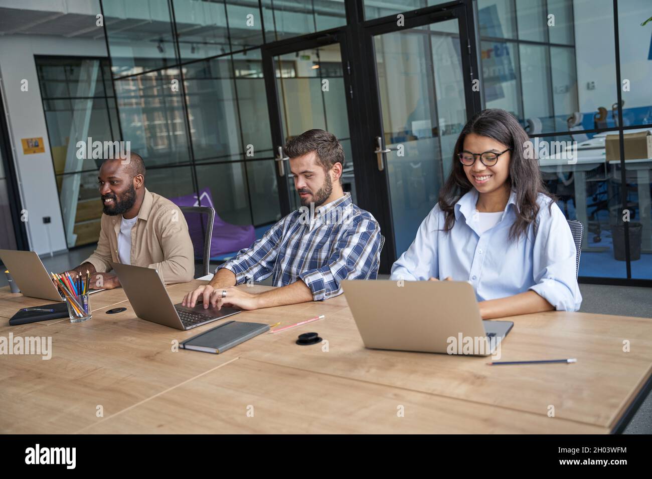 Staff discussing theme of job together with director Stock Photo - Alamy