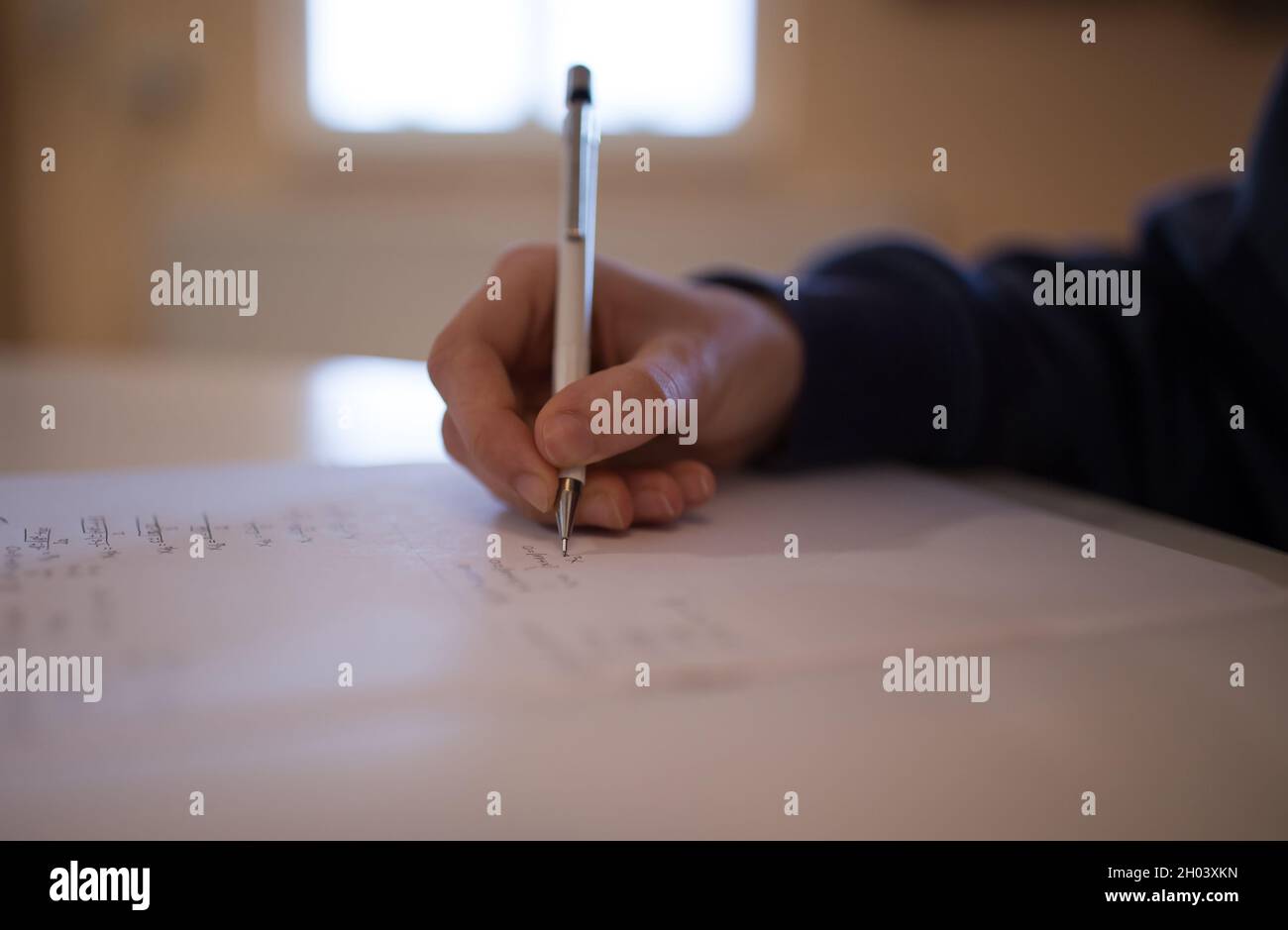 Girls hand holding pen writing hi-res stock photography and images - Alamy