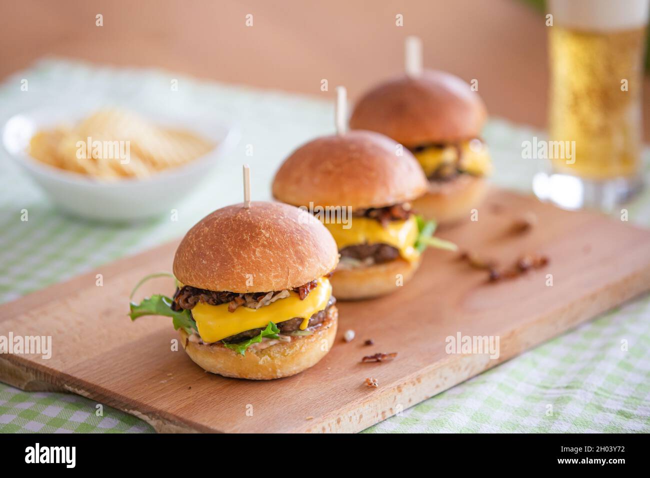 Three homemade burgers with angus meat Stock Photo - Alamy