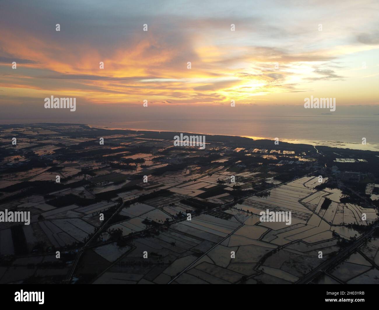 Aerial shot of the Kampung village near the flooding season of a paddy ...