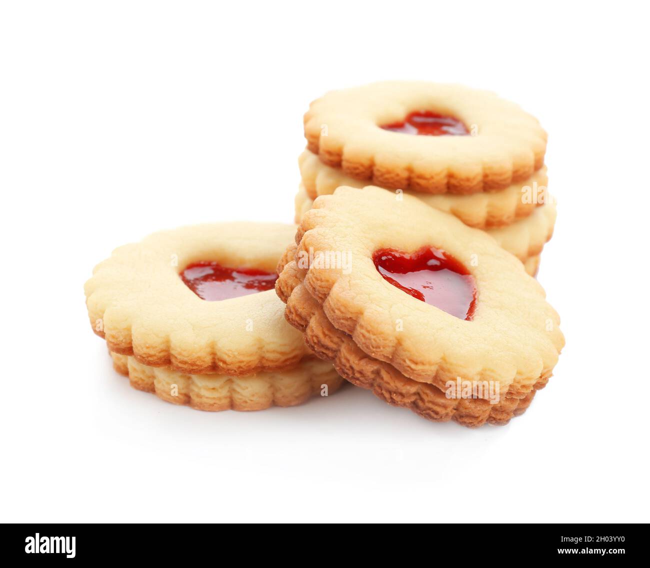 Traditional Christmas Linzer cookies with sweet jam on white background ...