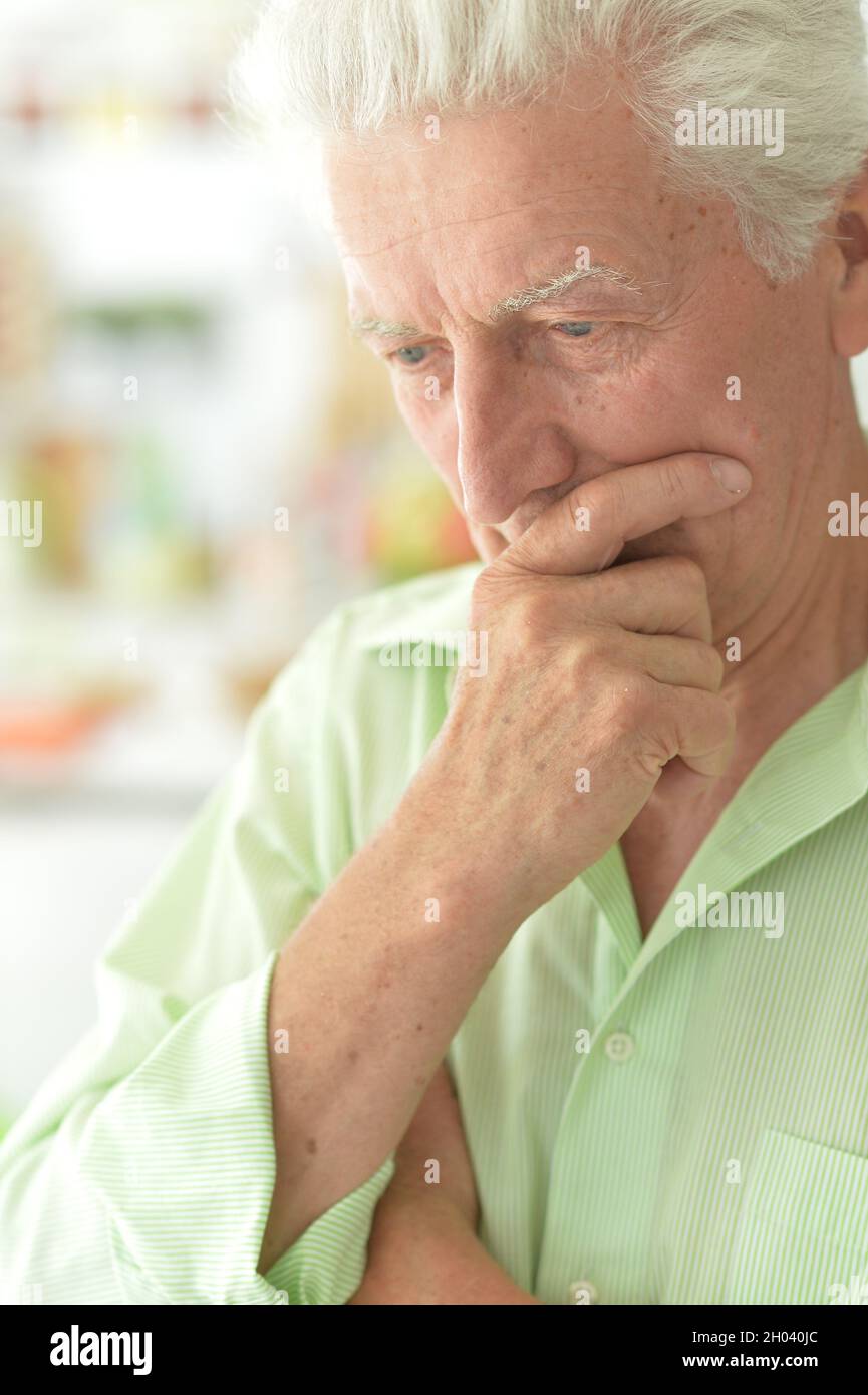 Portrait of a sad senior man thinking Stock Photo - Alamy