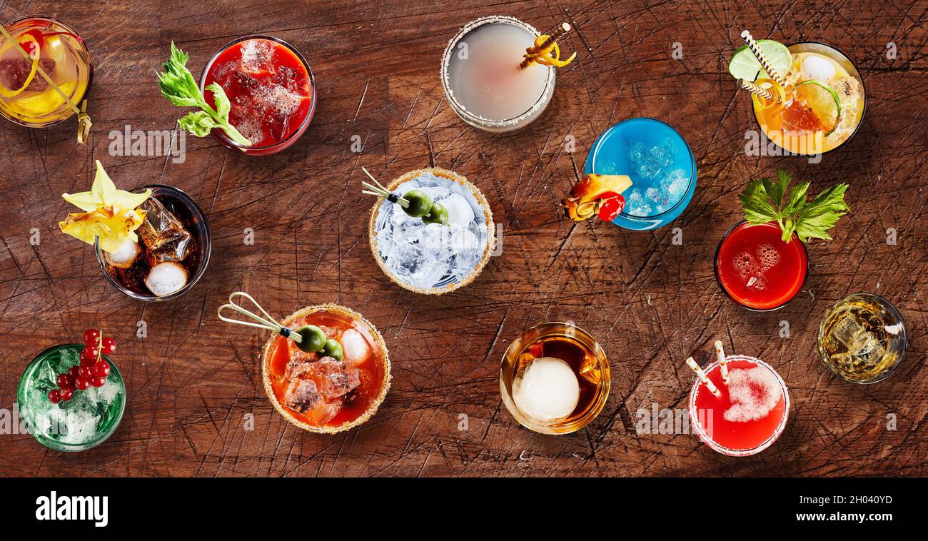 From above of arrangement of assorted refreshing colorful alcohol ...