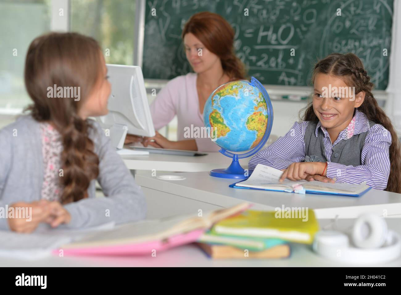 Happy children in class room hi-res stock photography and images - Alamy