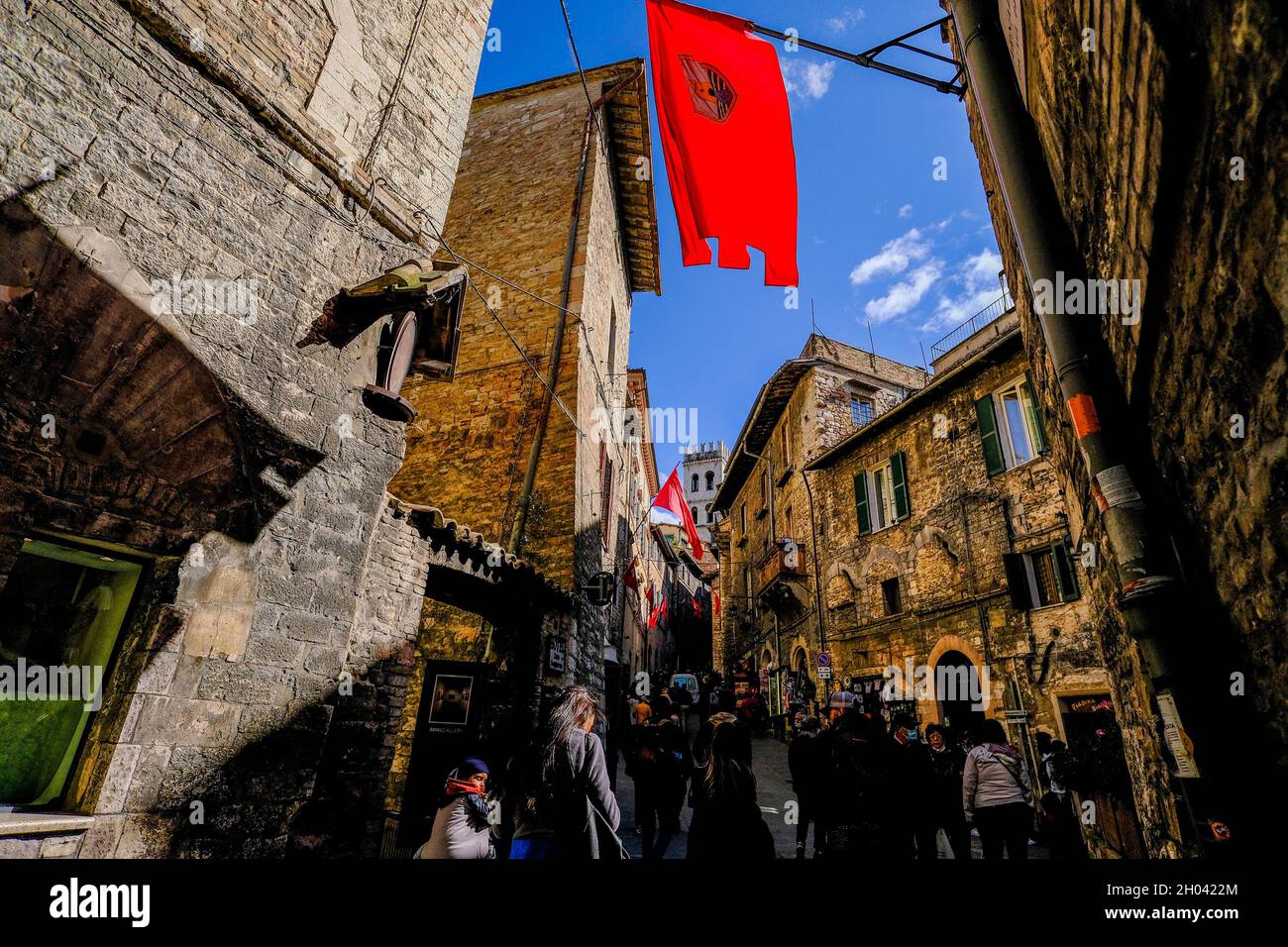 general view of the historic centre of assisi, tourists crowd the ...