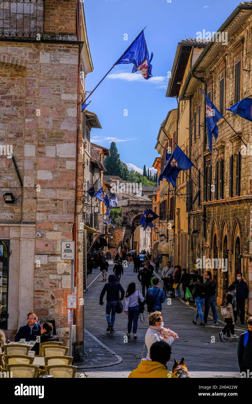 general view of the historic centre of assisi, tourists crowd the ...