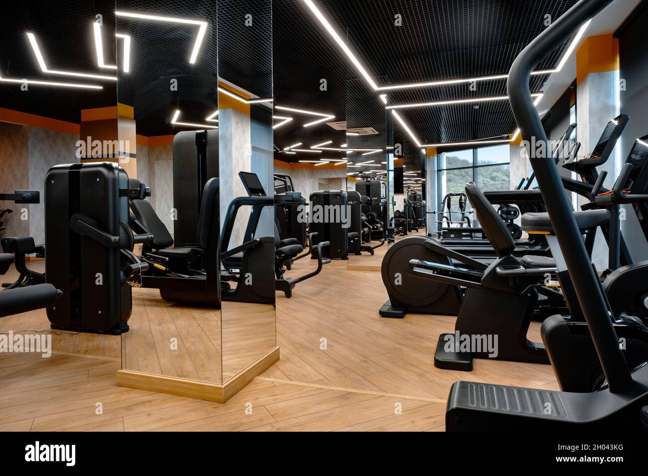 Modern gym interior with new fitness equipment Stock Photo - Alamy