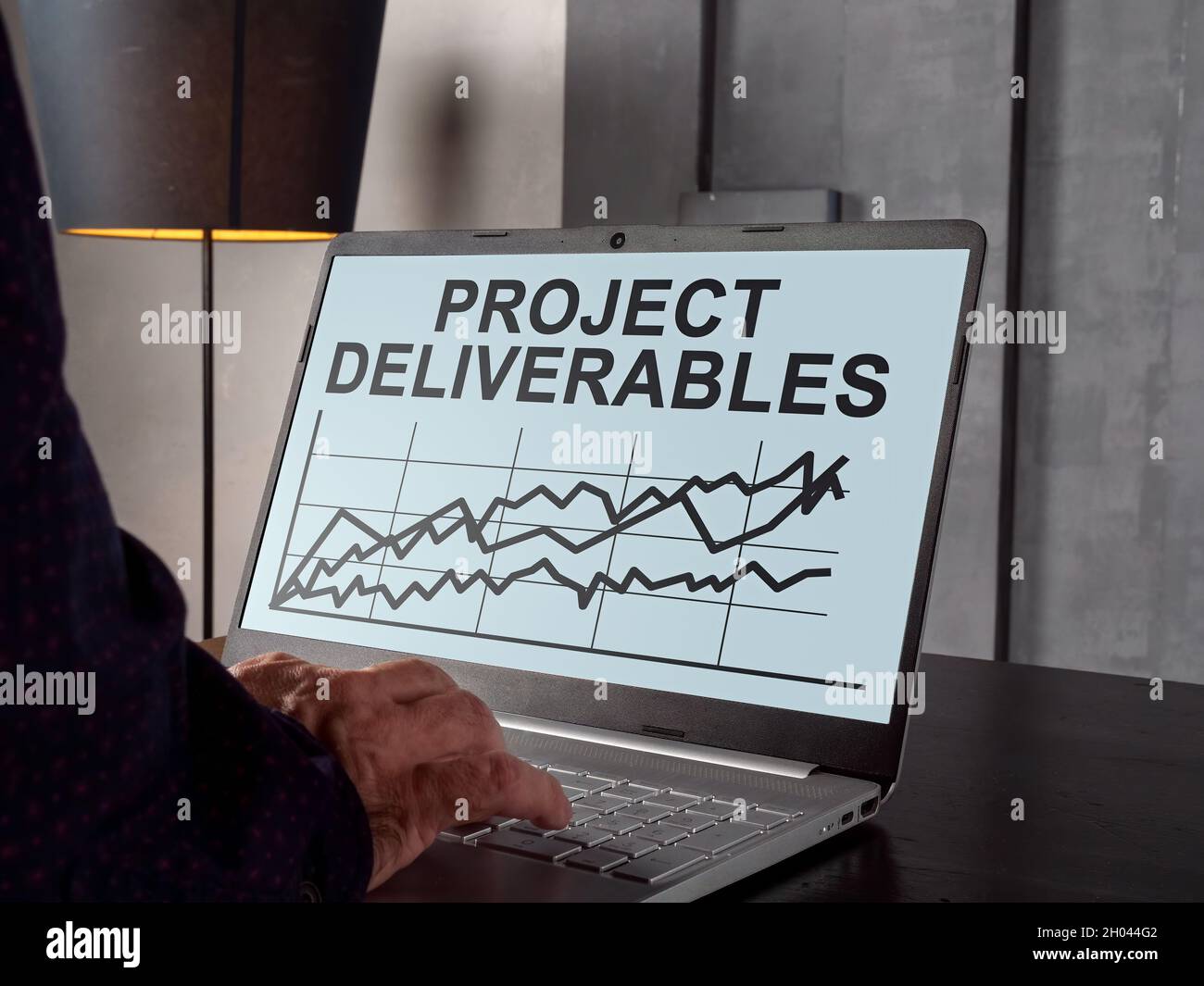 Project deliverables with charts on the laptop screen Stock Photo - Alamy