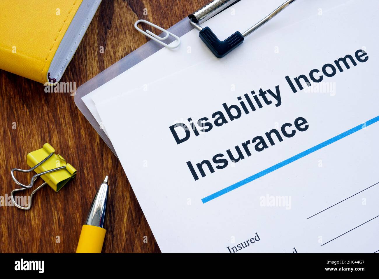 Disability Income DI Insurance application form and pen Stock Photo - Alamy