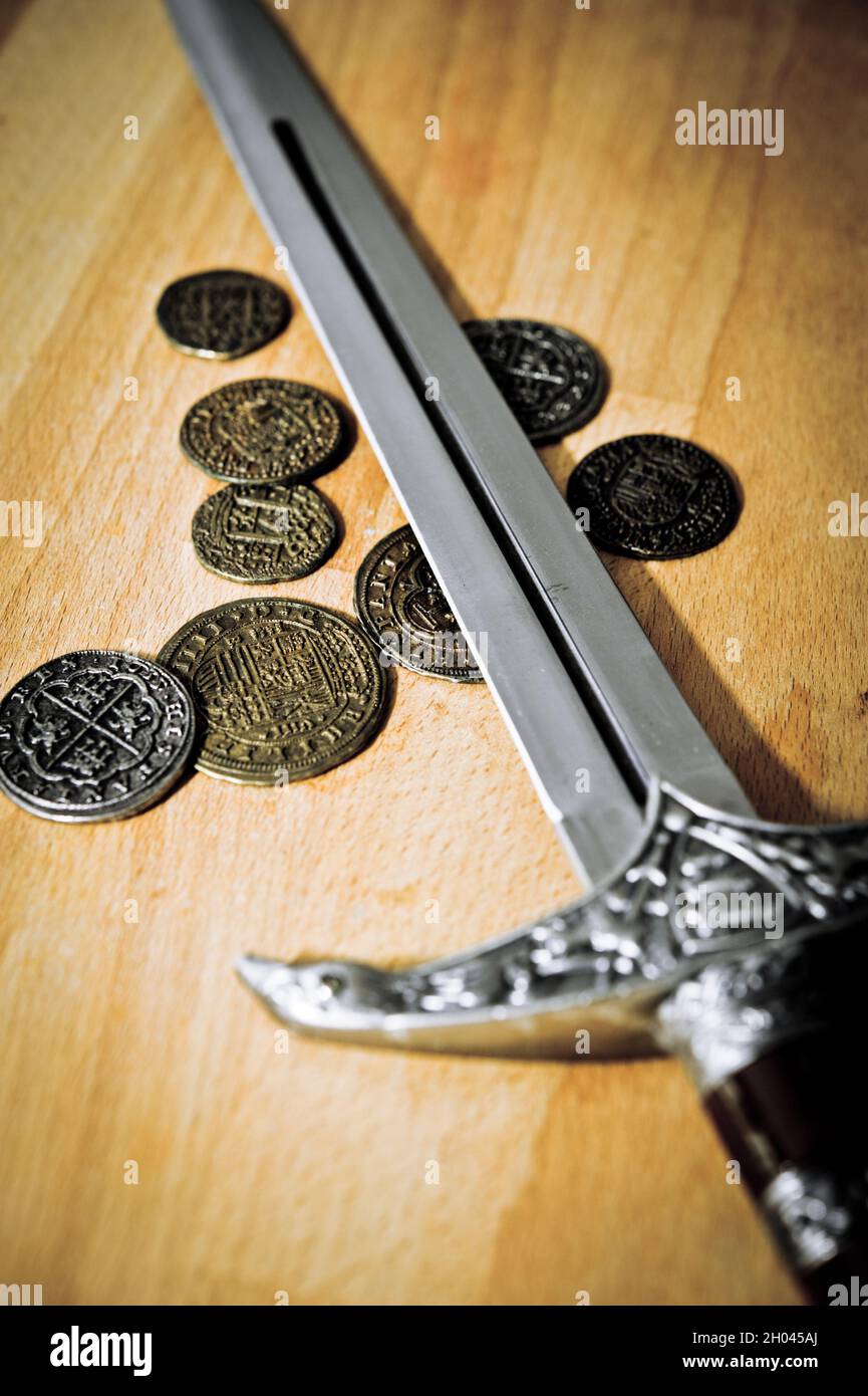 medieval sword and coins Stock Photo - Alamy