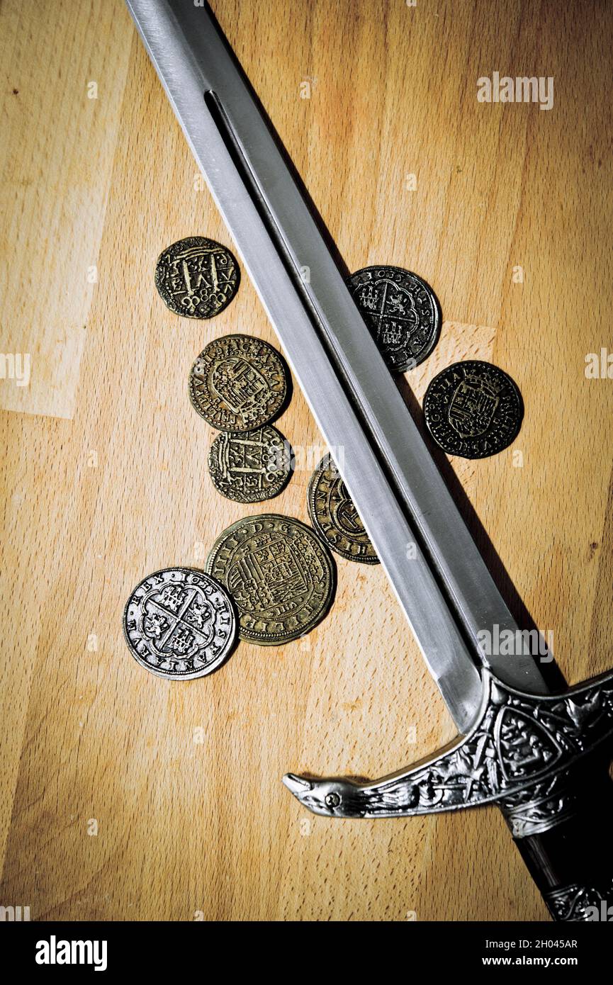medieval sword and coins Stock Photo - Alamy