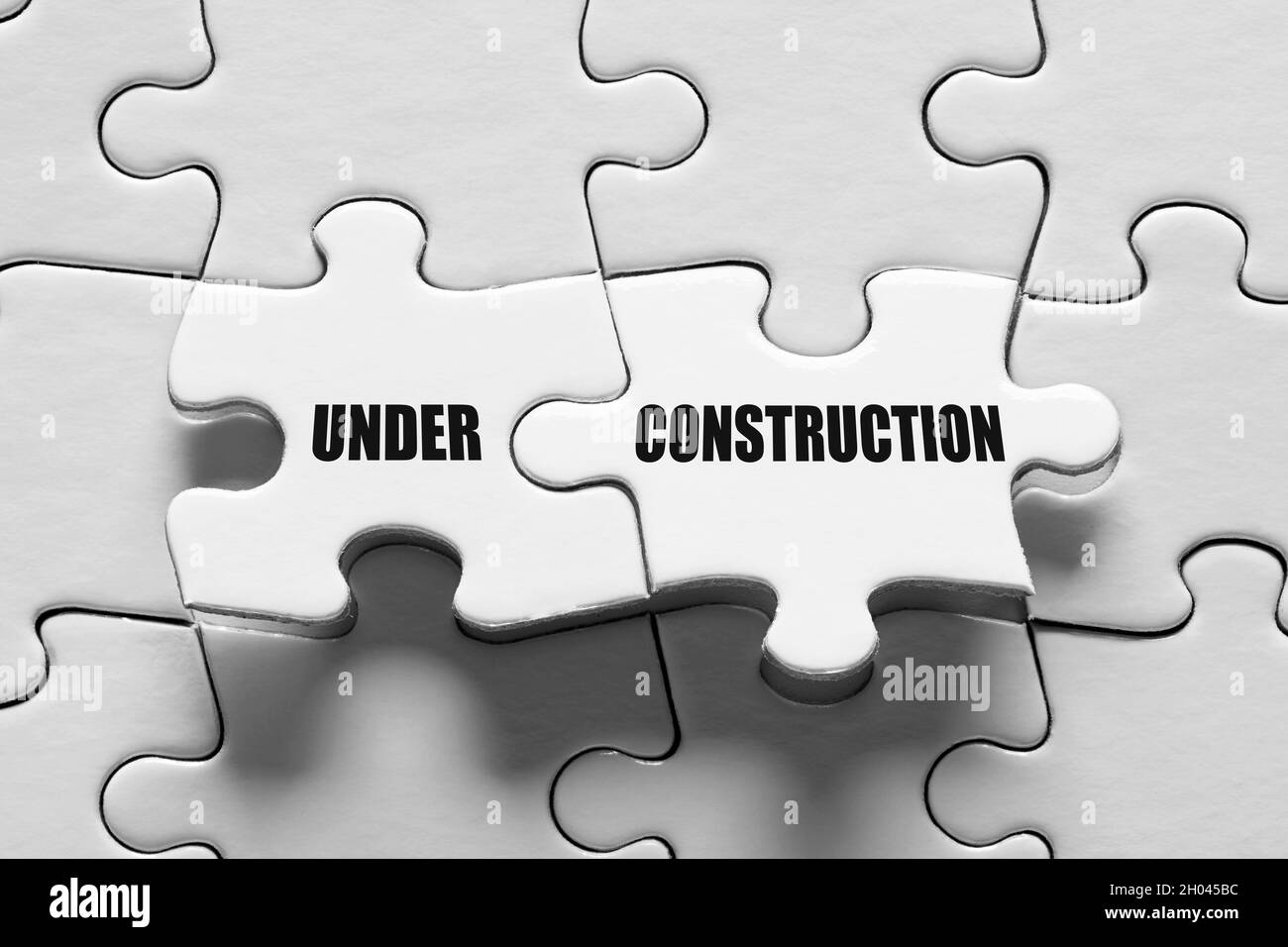 Under construction message on connected jigsaw puzzle pieces. Site ...