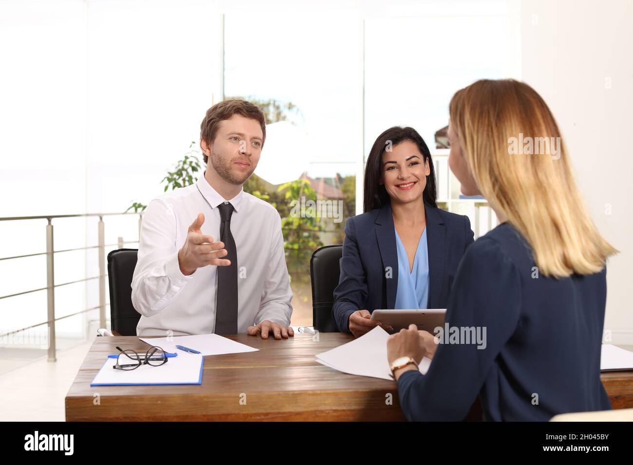 Human resources commission conducting job interview with applicant in office Stock Photo - Alamy