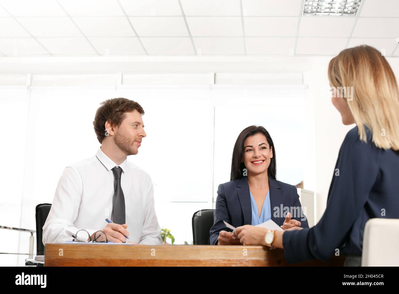 Human resources commission conducting job interview with applicant in office Stock Photo - Alamy