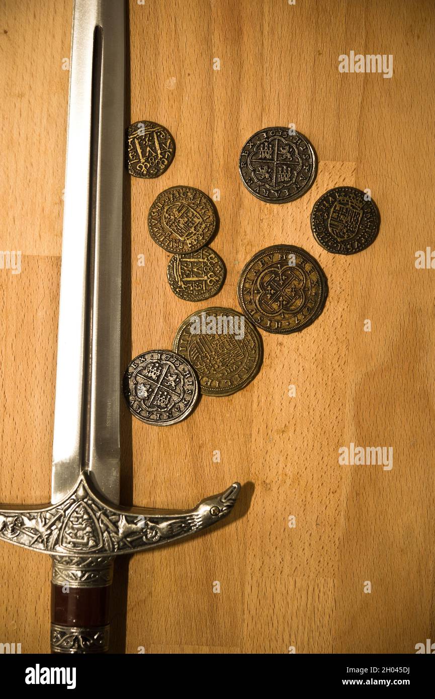 medieval sword and coins Stock Photo - Alamy