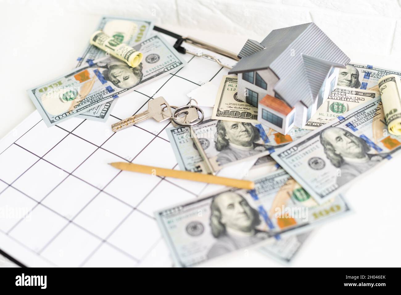 house layout and dollar bills on the background Stock Photo - Alamy