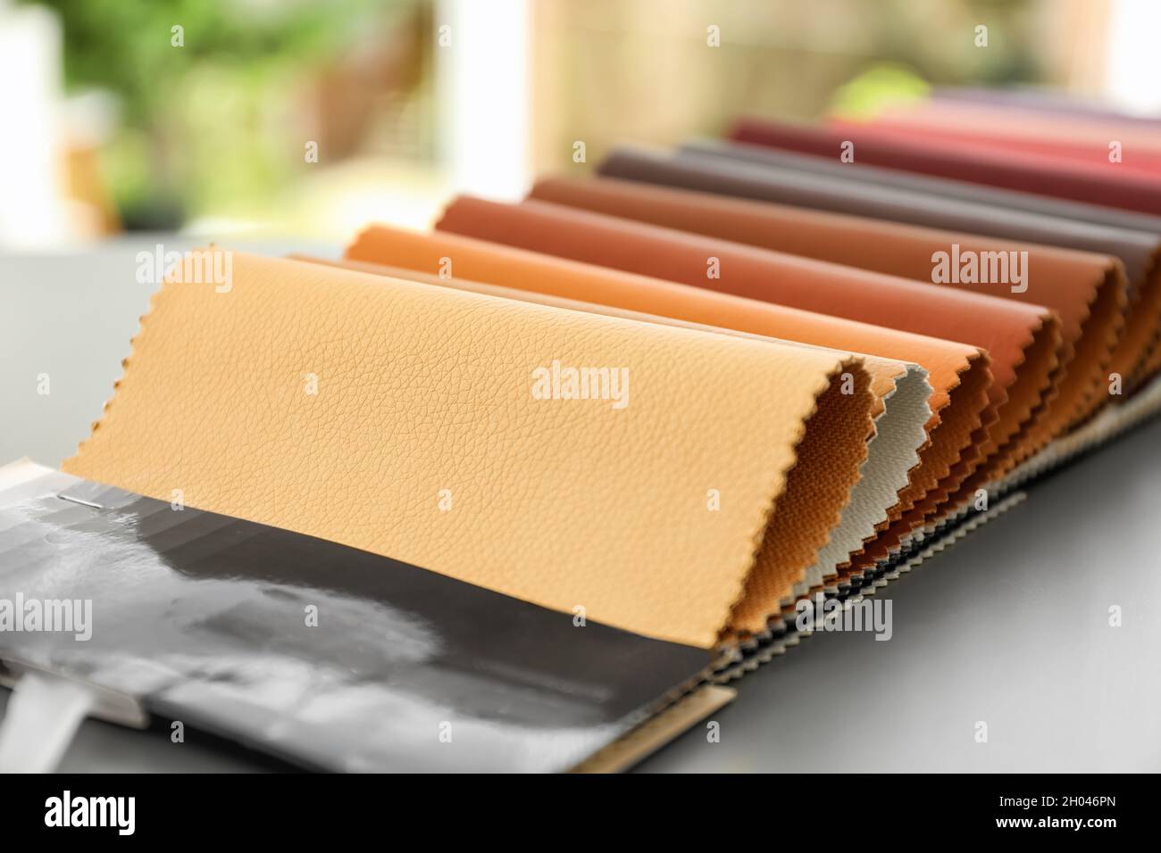 Leather samples of different colors for interior design on table Stock ...